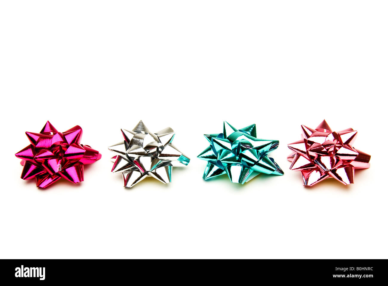 Four christmas gift wrapping bows on white background Stock Photo - Alamy