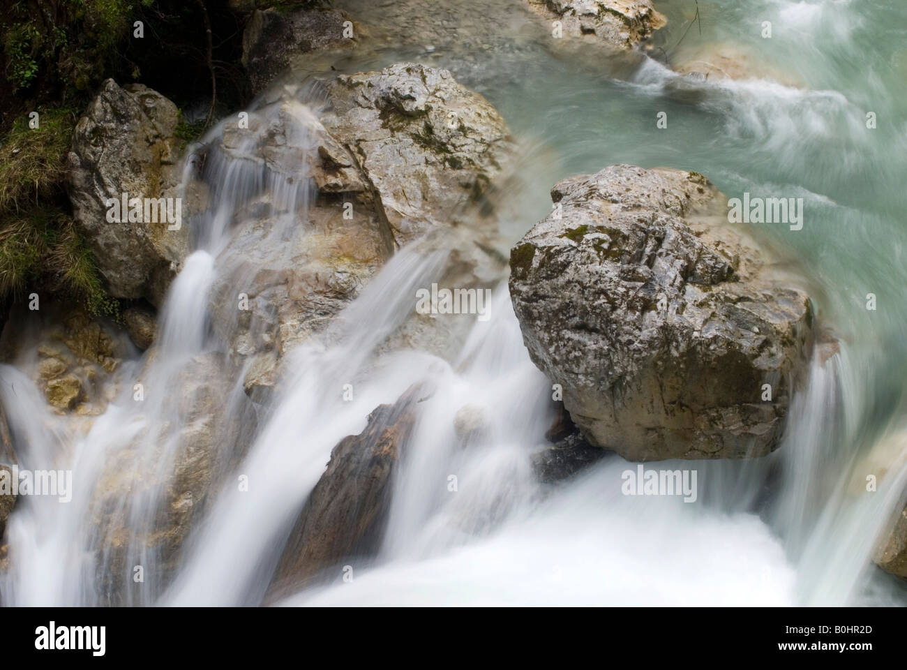 Water rushing over rocks in the rapids of the Wolfsklamm Gorge near ...