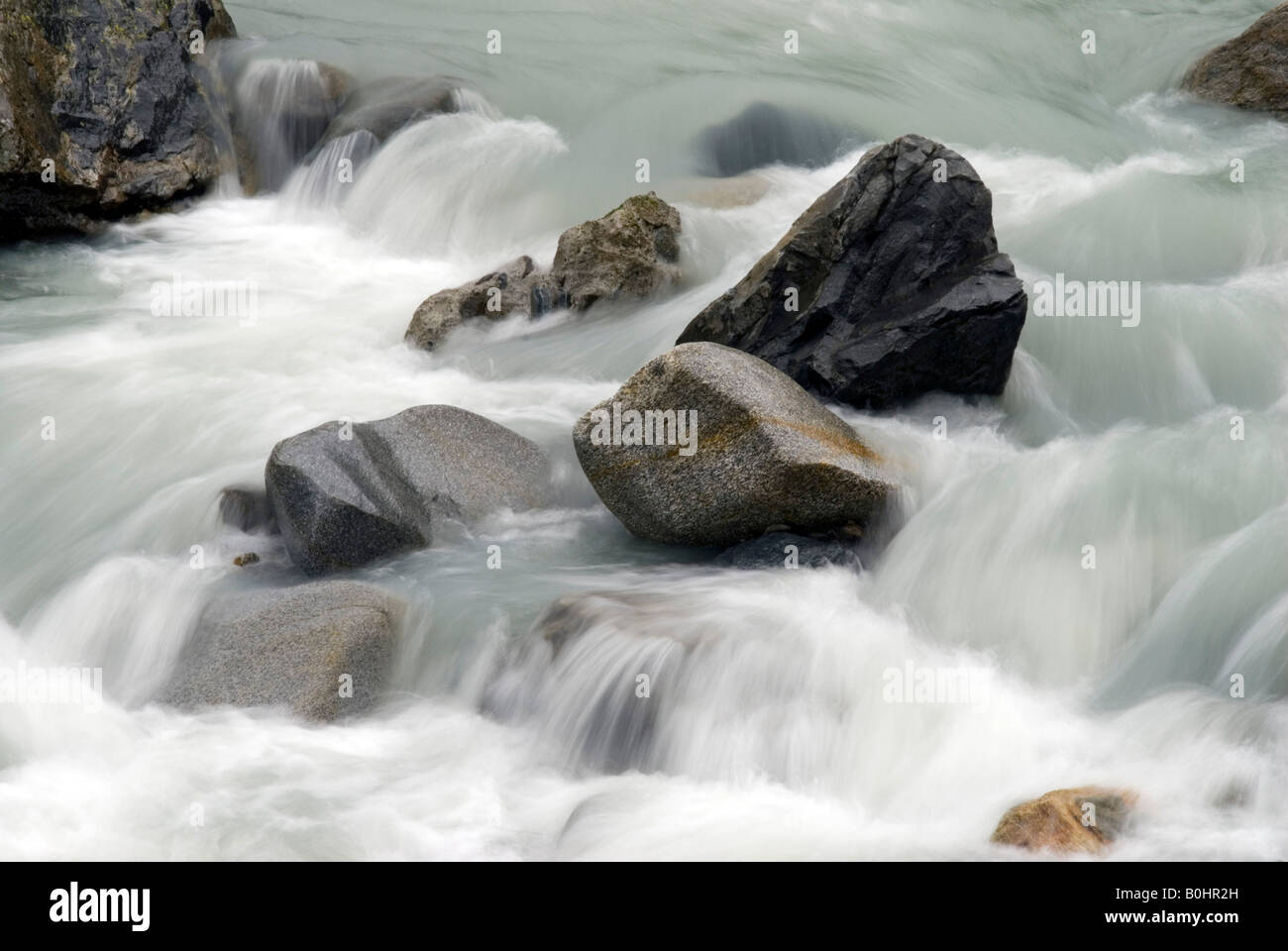 Water gushing over rocks in the Pitz mountain stream, Pitztal valley ...