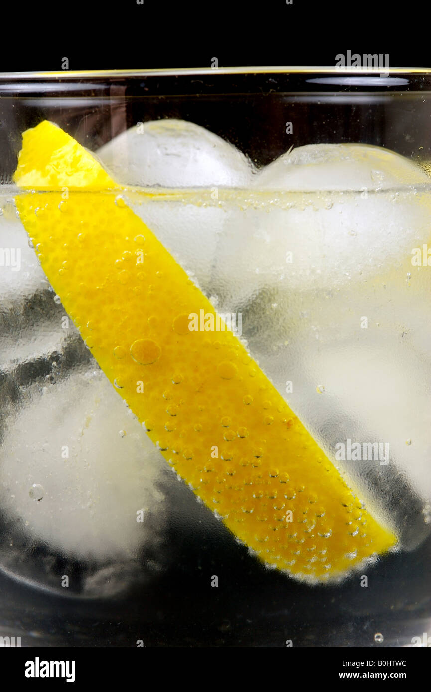 Ice water with a twist of lemon Stock Photo - Alamy