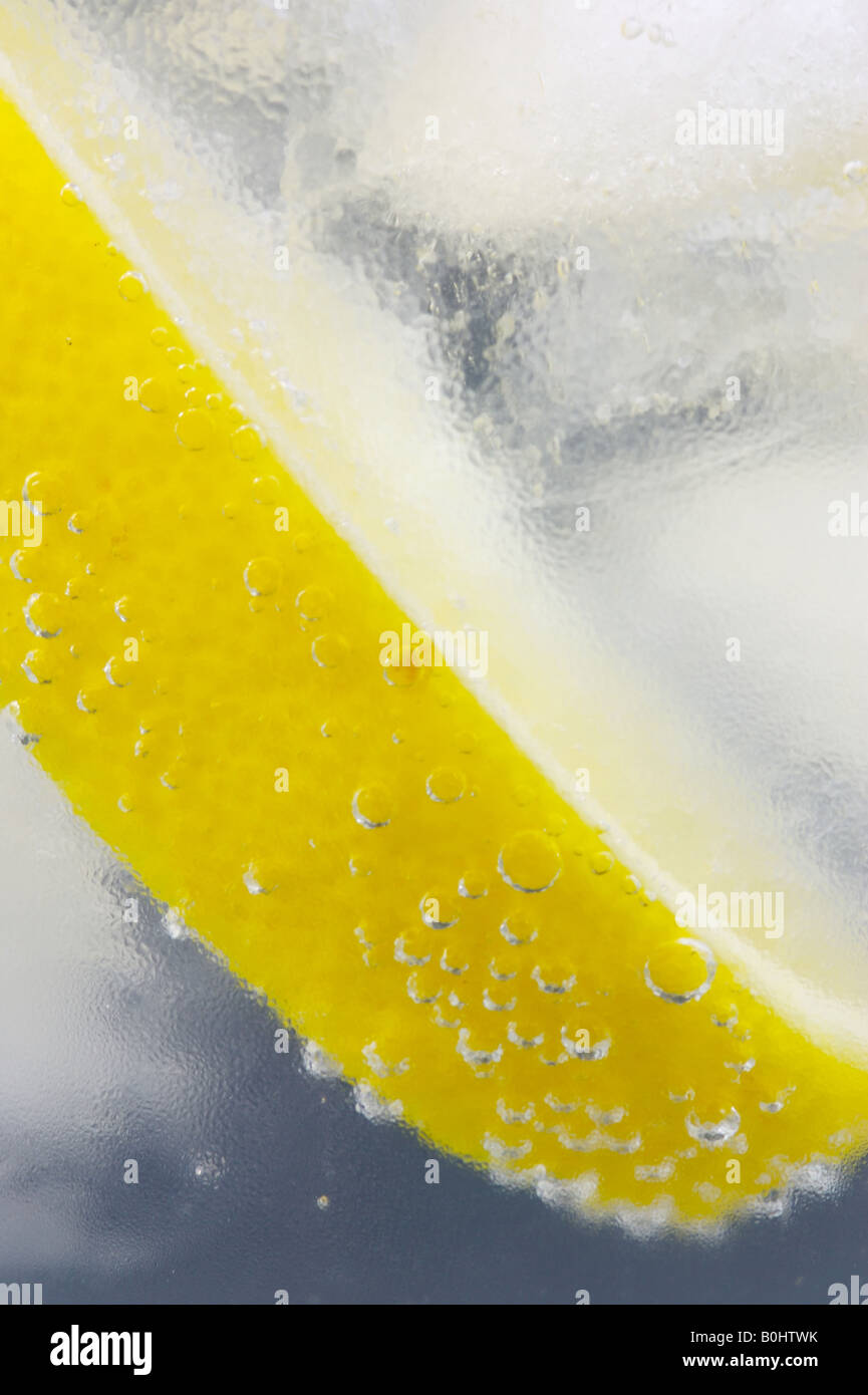 Ice water with a twist of lemon Stock Photo - Alamy