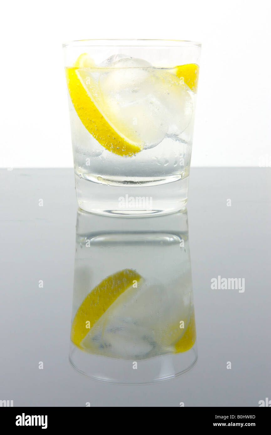 Ice water with a twist of lemon Stock Photo - Alamy