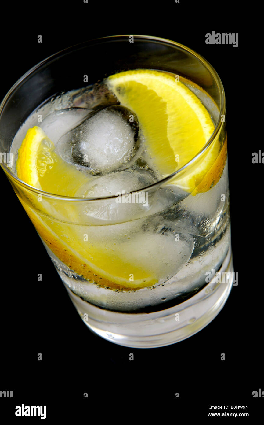 Ice water with a twist of lemon Stock Photo - Alamy