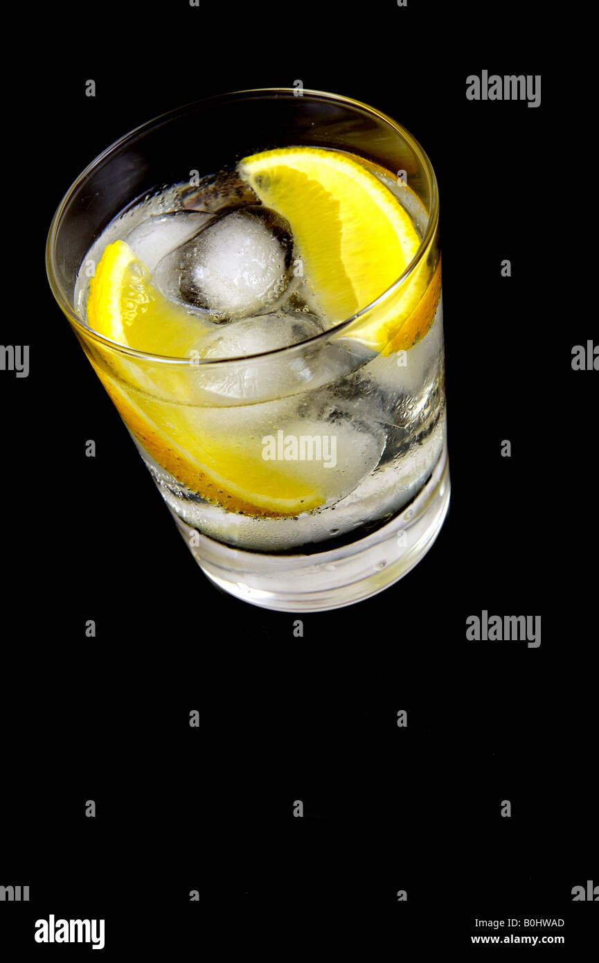Ice water with a twist of lemon Stock Photo - Alamy