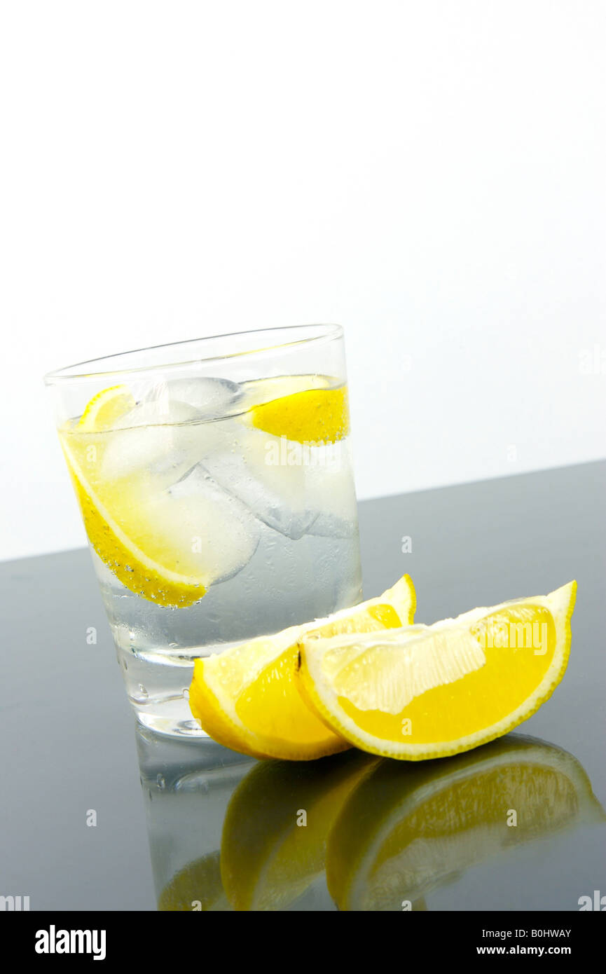 Ice water with a twist of lemon Stock Photo - Alamy