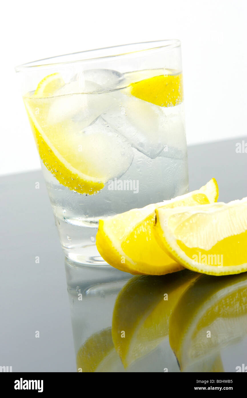 Ice water with a twist of lemon Stock Photo - Alamy