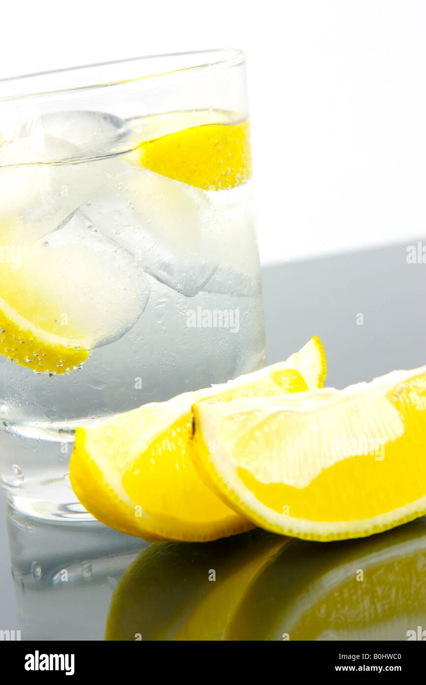 Ice water with a twist of lemon Stock Photo - Alamy