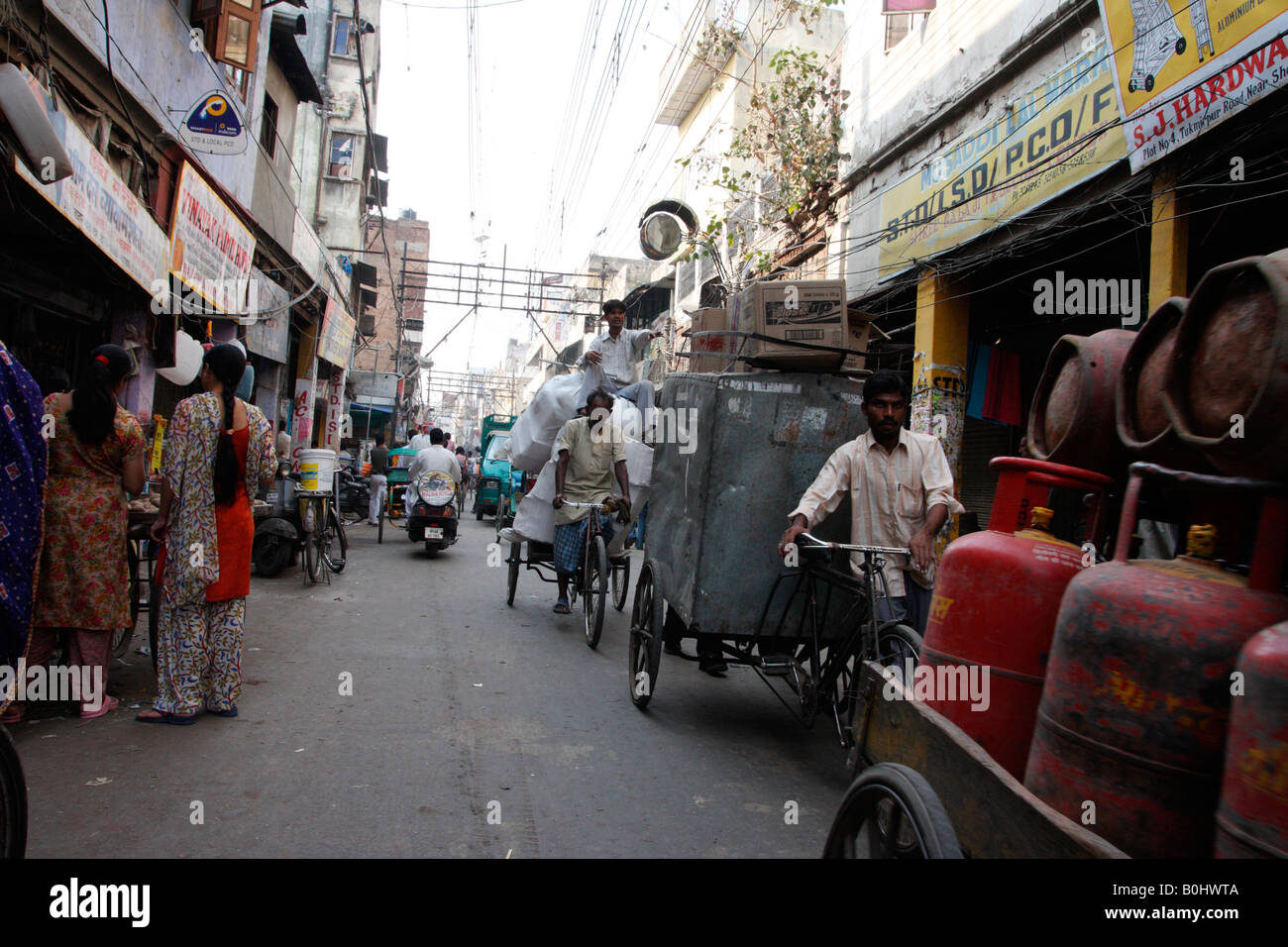 Rickshaws In A Street Of Delhi High Resolution Stock Photography and ...