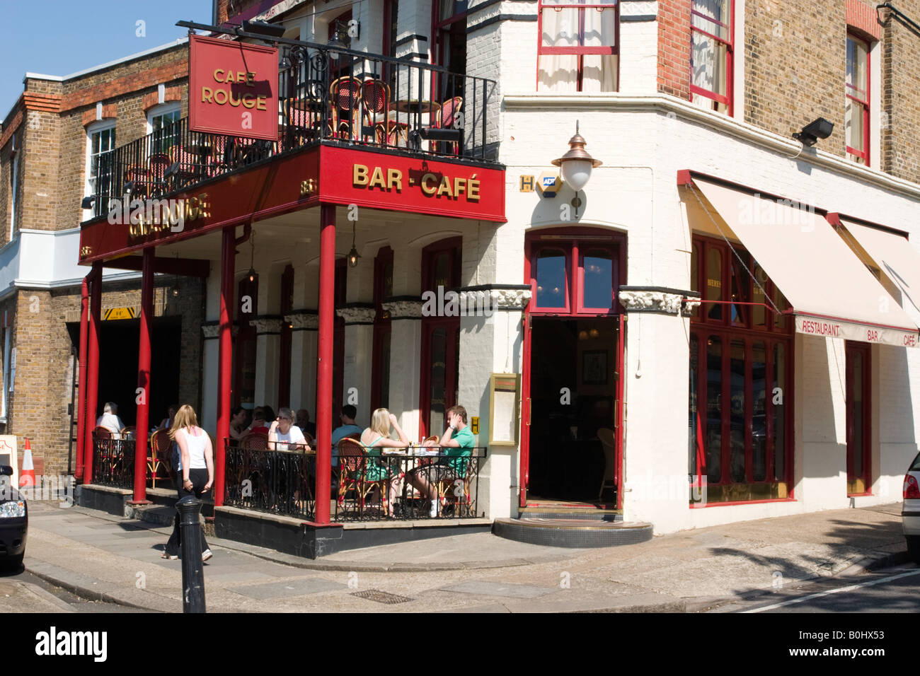 People sit outside a cafe Strand on the Green Chiswick London Stock ...