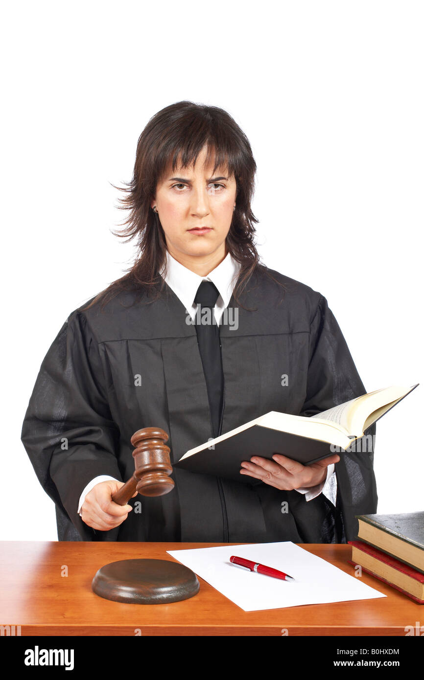 A female judge in a courtroom striking the gavel Shallow depth of field ...