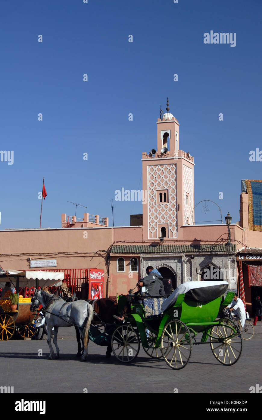 Mosque and horse and cart, Marrakech Morocco Stock Photo - Alamy