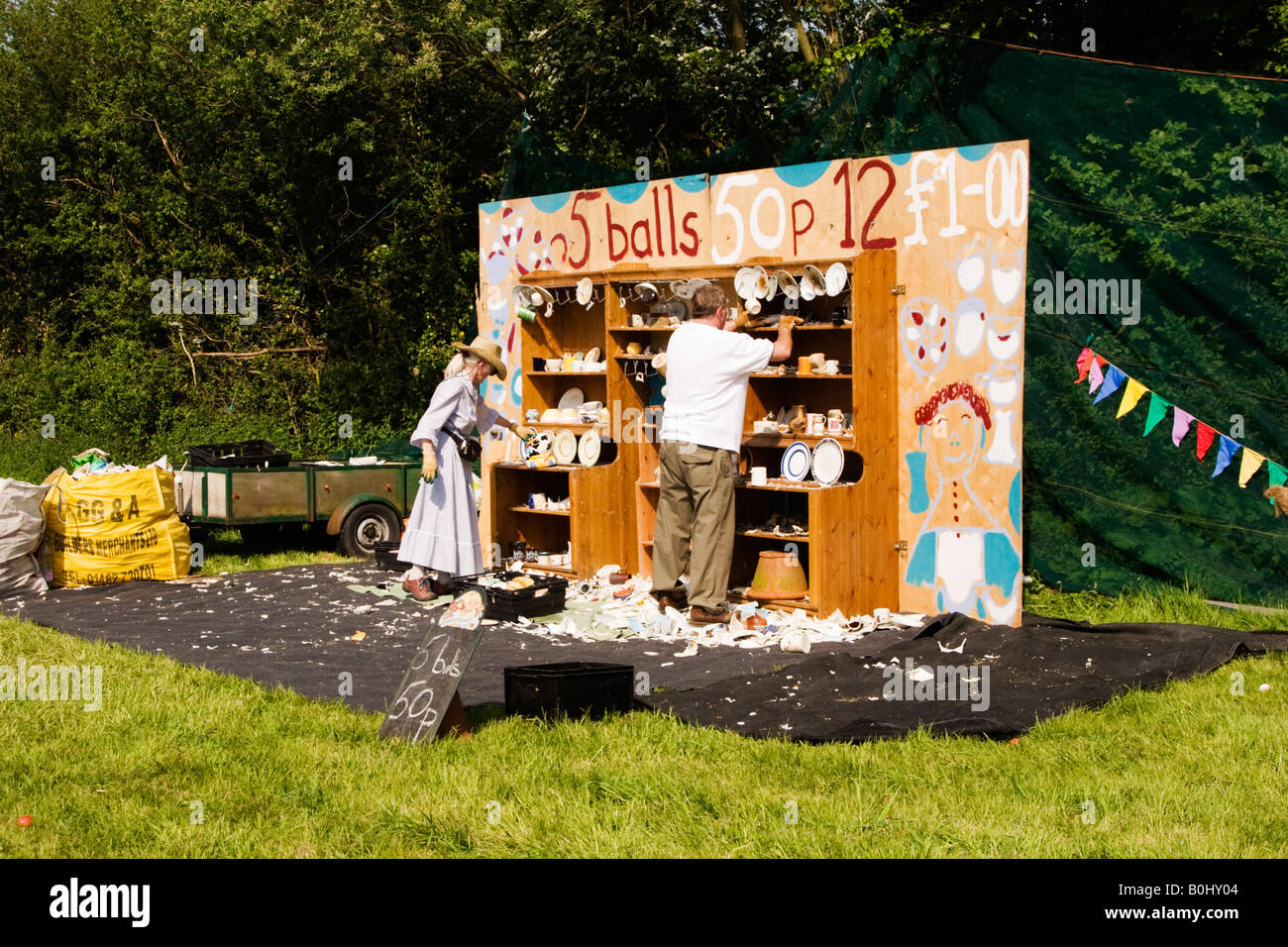 Plate and chine smashing stall at country fair Stock Photo - Alamy