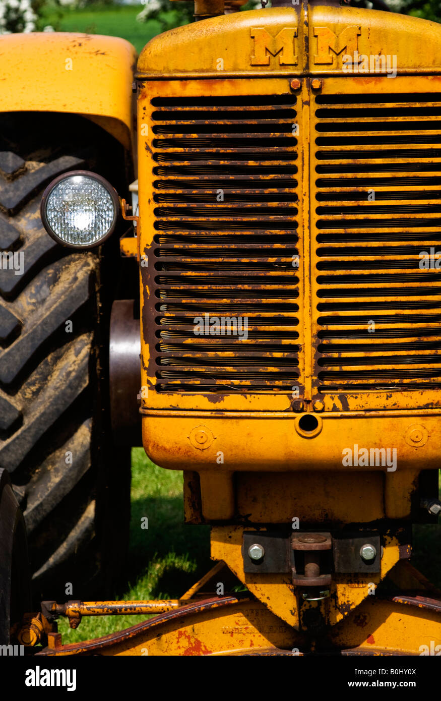 Old yellow farm tractor with rusty radiator grill Stock Photo - Alamy