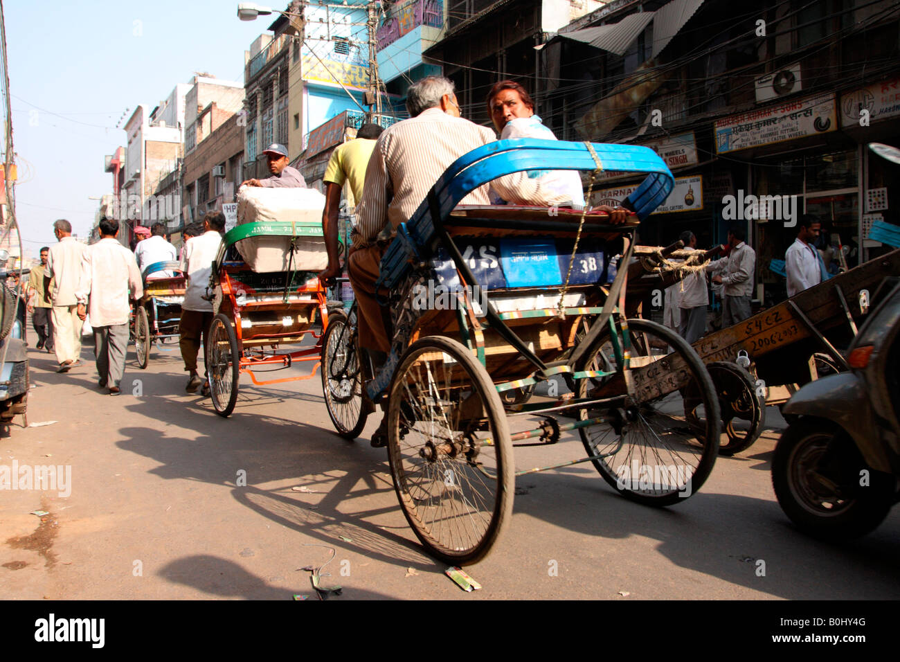 Rickshaws In A Street Of Delhi High Resolution Stock Photography and ...
