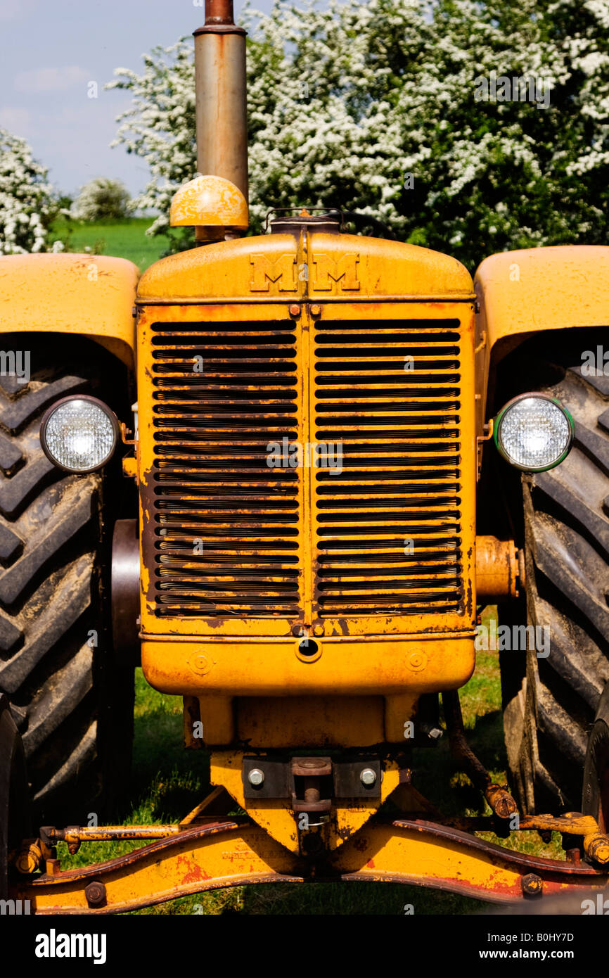 Old yellow farm tractor with rusty radiator grill Stock Photo - Alamy