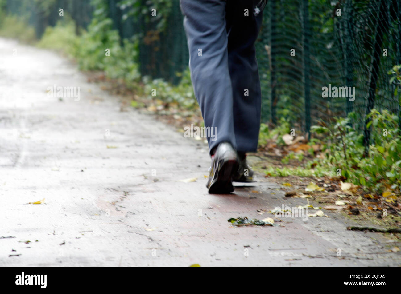 Lonely runner on road hi-res stock photography and images - Alamy