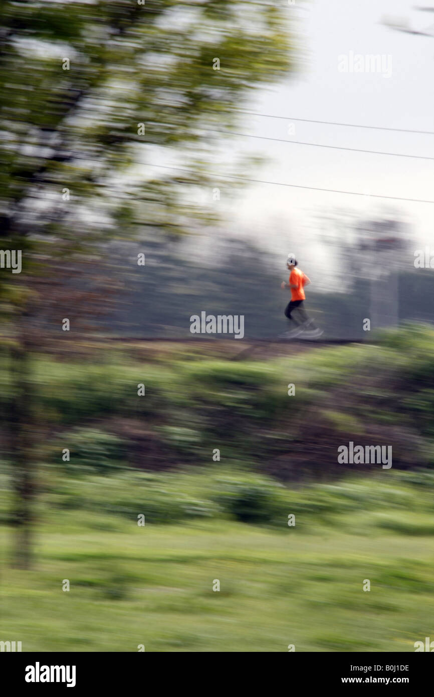 fast man runner on country lane Stock Photo - Alamy