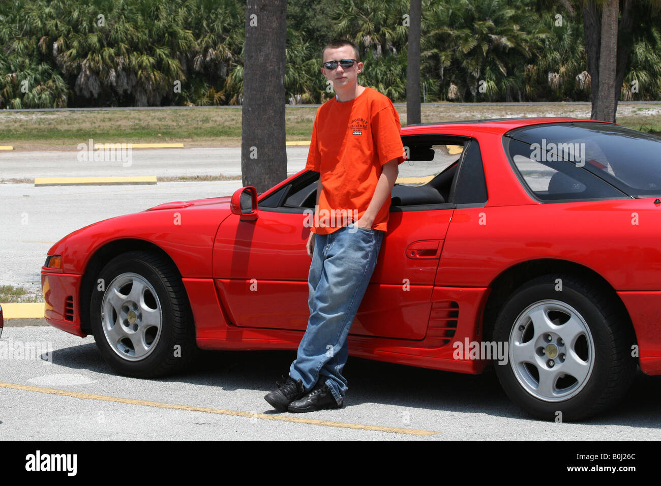 Boy leaning against car hi-res stock photography and images - Alamy