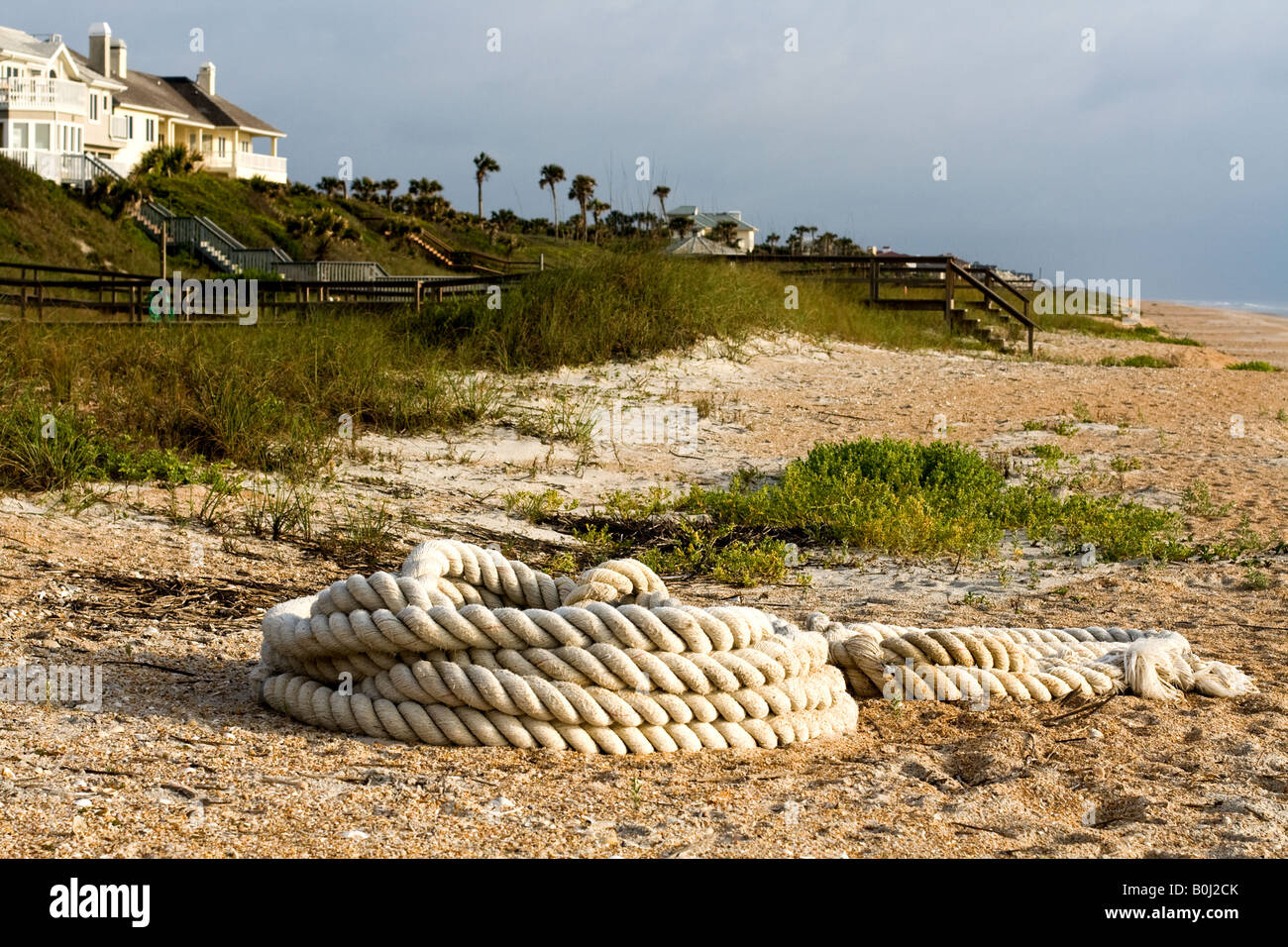Coil of thick white rope sitting on a beach in Ponte Vedra beach ...