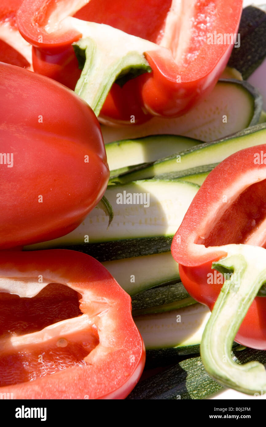 Sliced red bell peppers and courgettes/ zucchini Stock Photo - Alamy