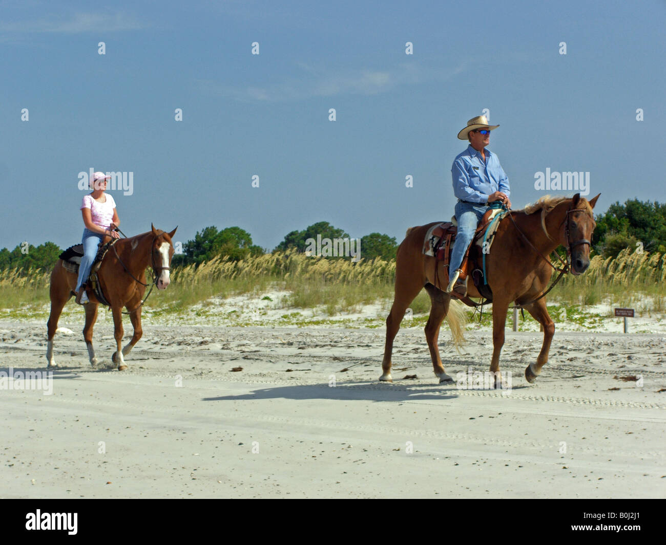 Two horseback riders Stock Photo - Alamy