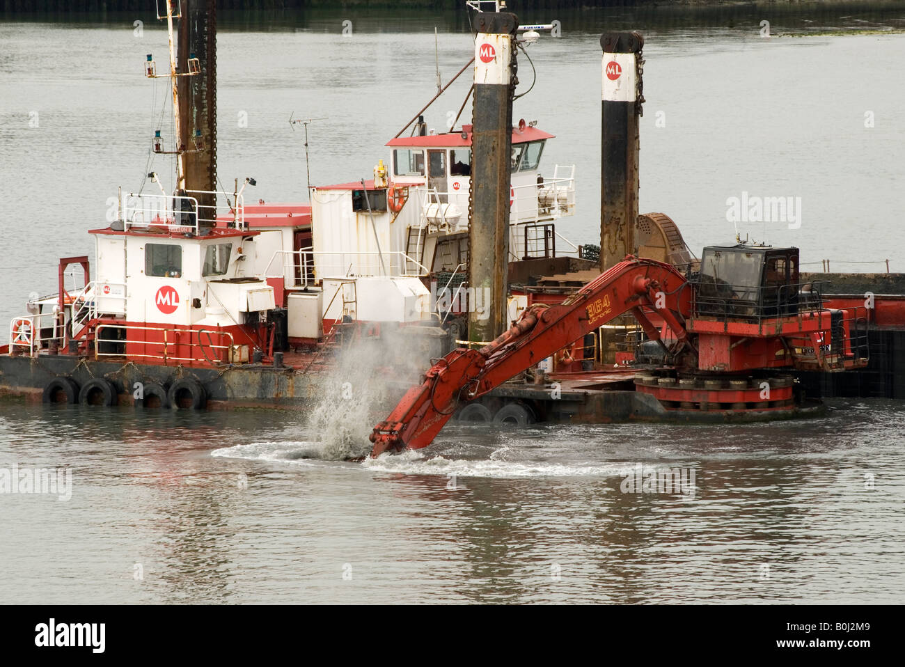 dredger with digger Stock Photo - Alamy