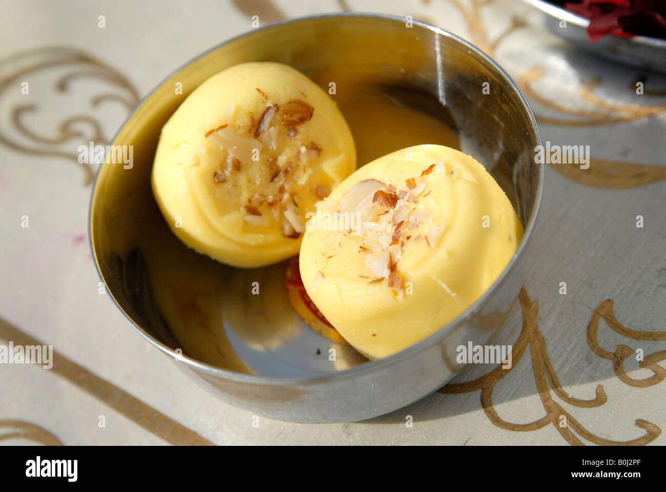 A bowl containing Ghee (purified butter). Used to to feed the sacred ...