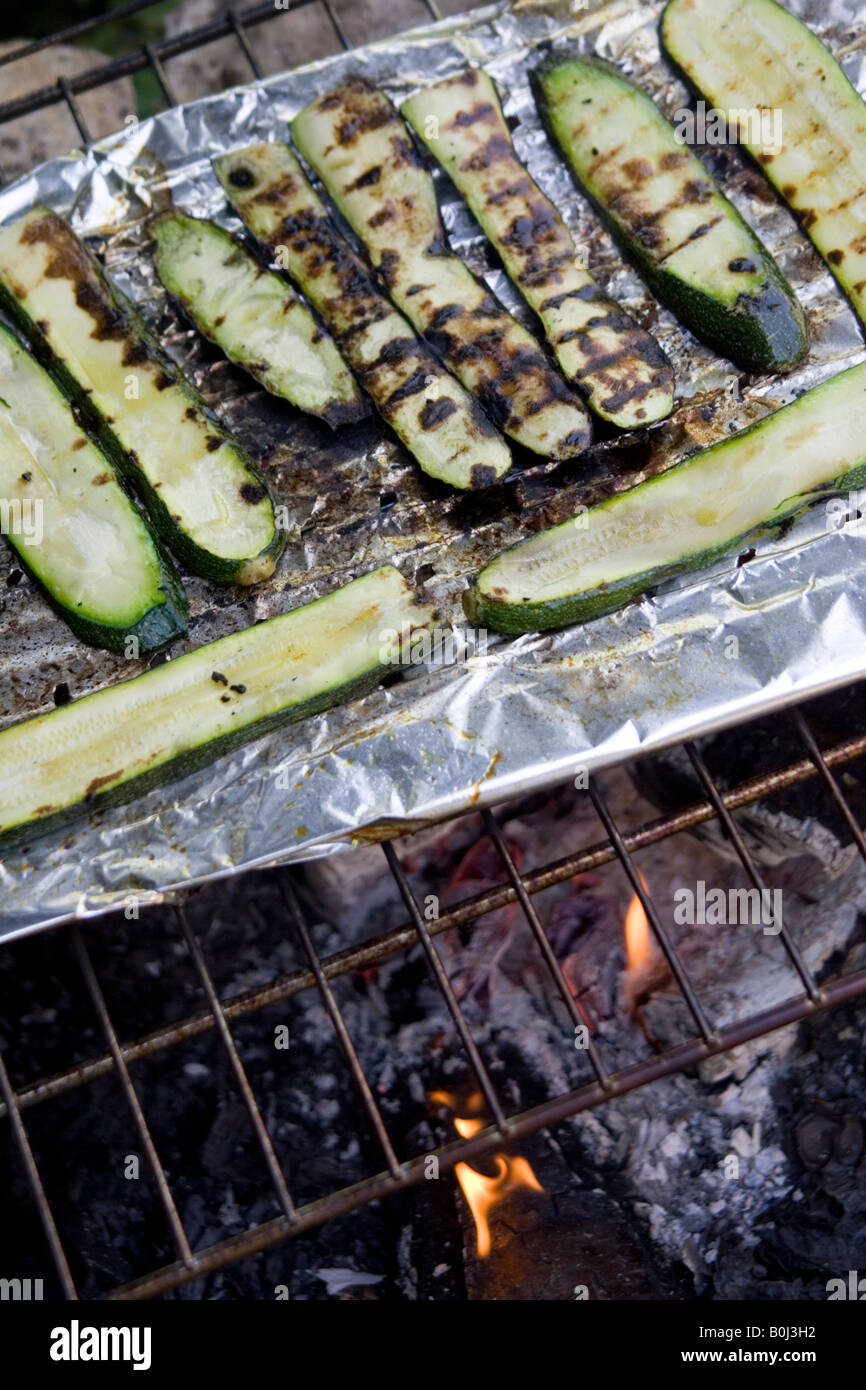 Sliced courgette/ zucchini cooking on the barbecue Stock Photo - Alamy