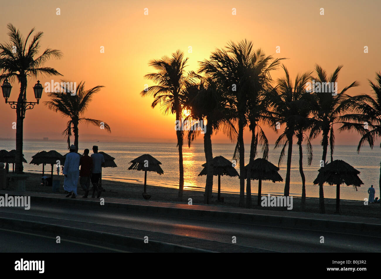 Sunset over a beach at Muscat OMAN Stock Photo - Alamy