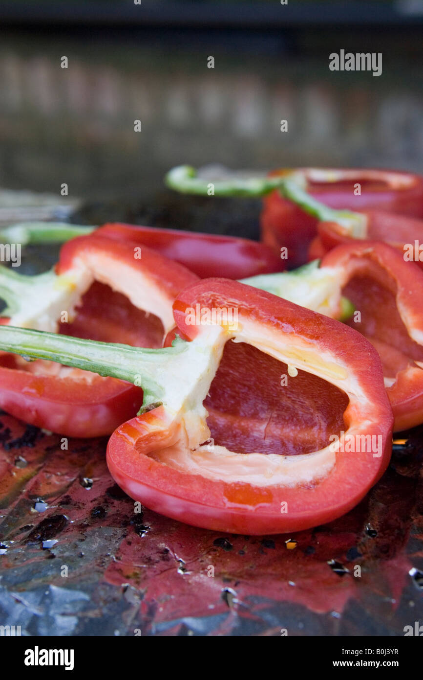 Red bell peppers cooking on the barbecue Stock Photo - Alamy