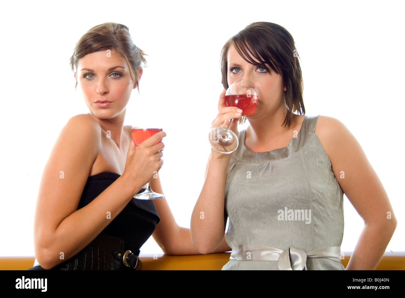 two women drinking at a bar Stock Photo - Alamy