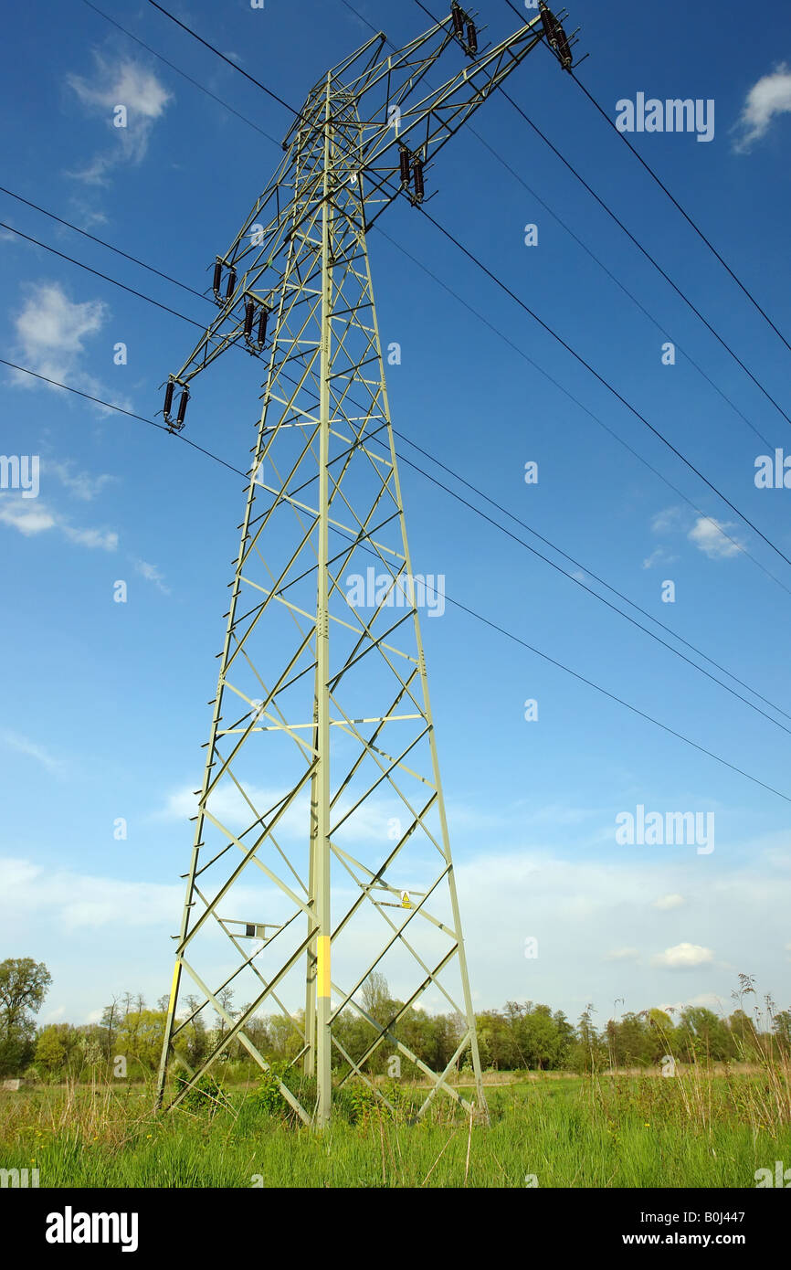 High voltage pylon at countryside over blue sky Stock Photo - Alamy