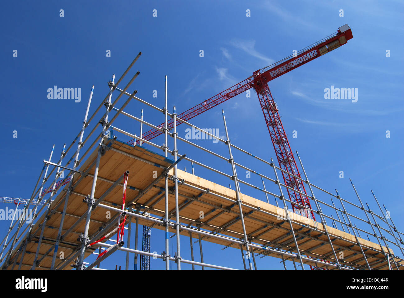 scaffolding at building site against blue skies Stock Photo - Alamy