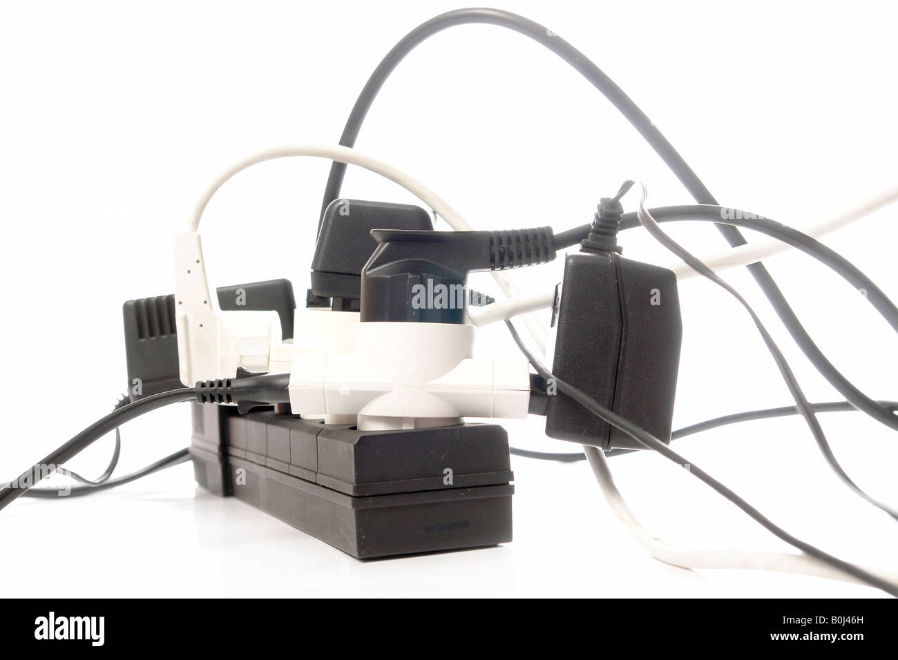 Electrical power strip overloaded with many plugs Stock Photo - Alamy