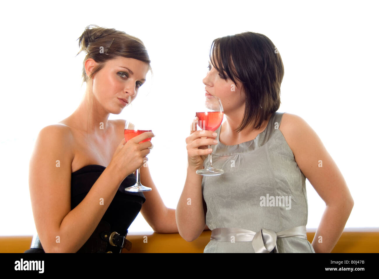 two women drinking at a bar Stock Photo - Alamy