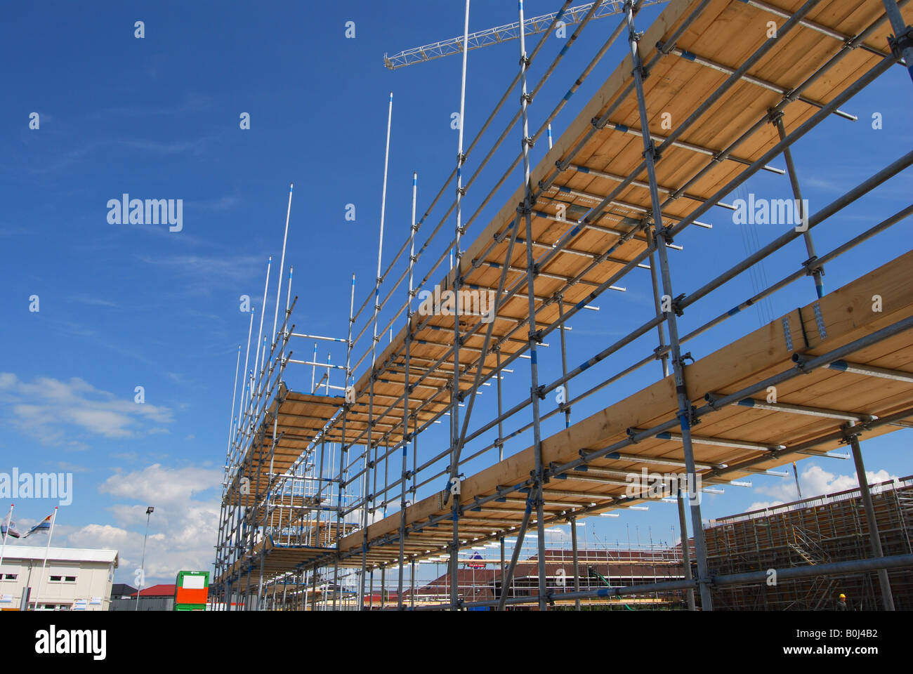 scaffolding at building site against blue skies Stock Photo - Alamy