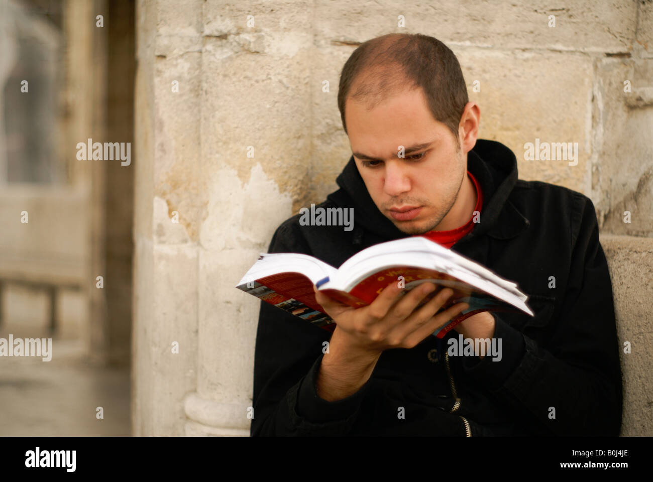 young man reading Stock Photo - Alamy