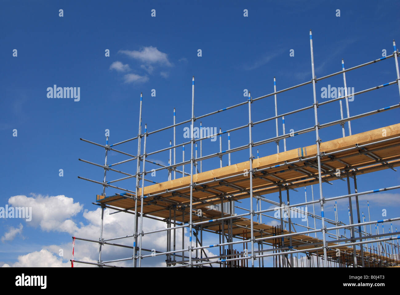 scaffolding at building site against blue skies Stock Photo - Alamy