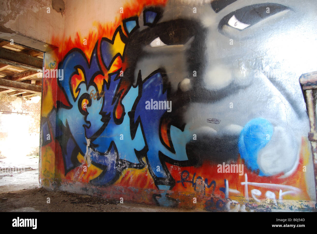 Detail of Graffiti covered wall with human portrait Stock Photo - Alamy