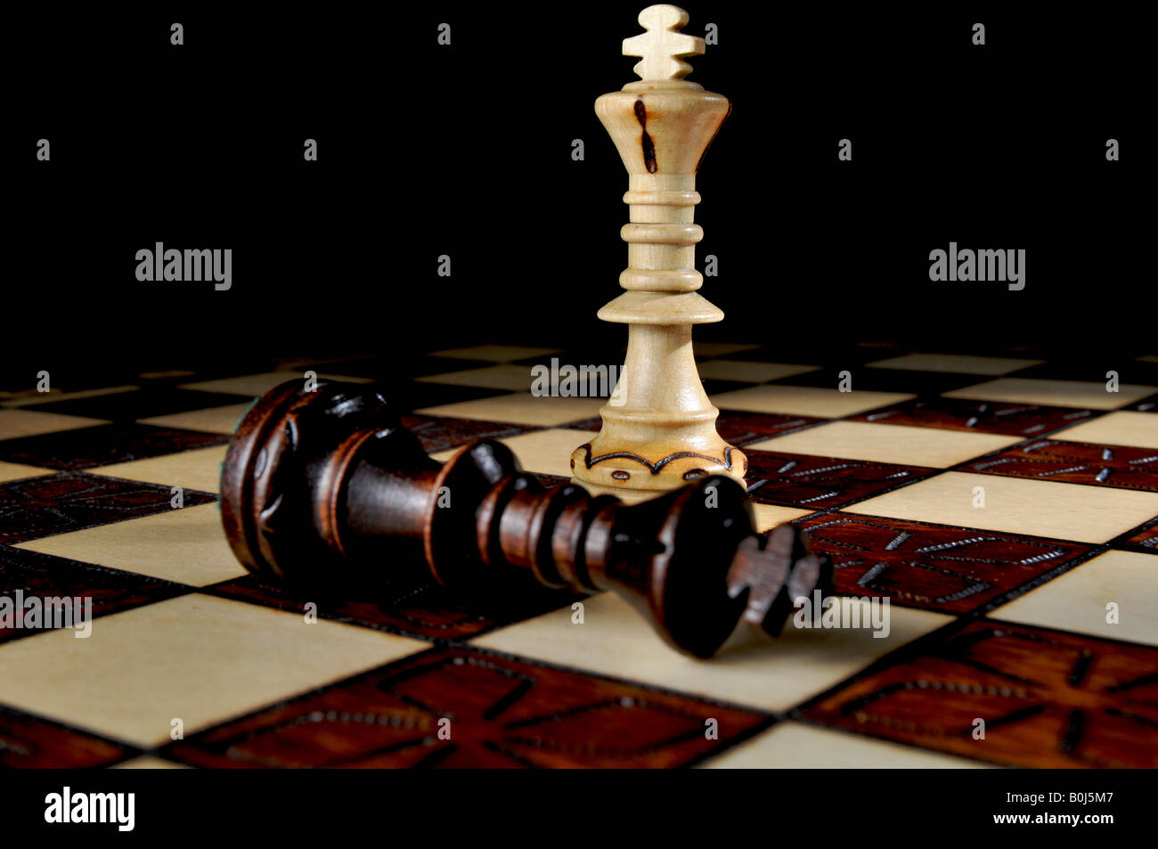 Two kings on a chess board Stock Photo - Alamy