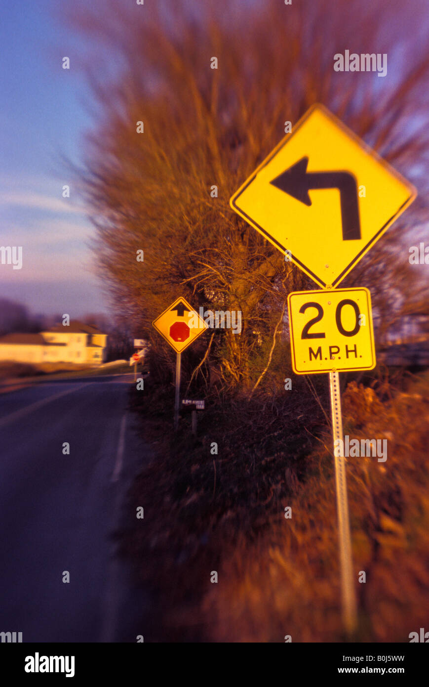 traffic directional left ture and 20 mph speed signs Stock Photo - Alamy