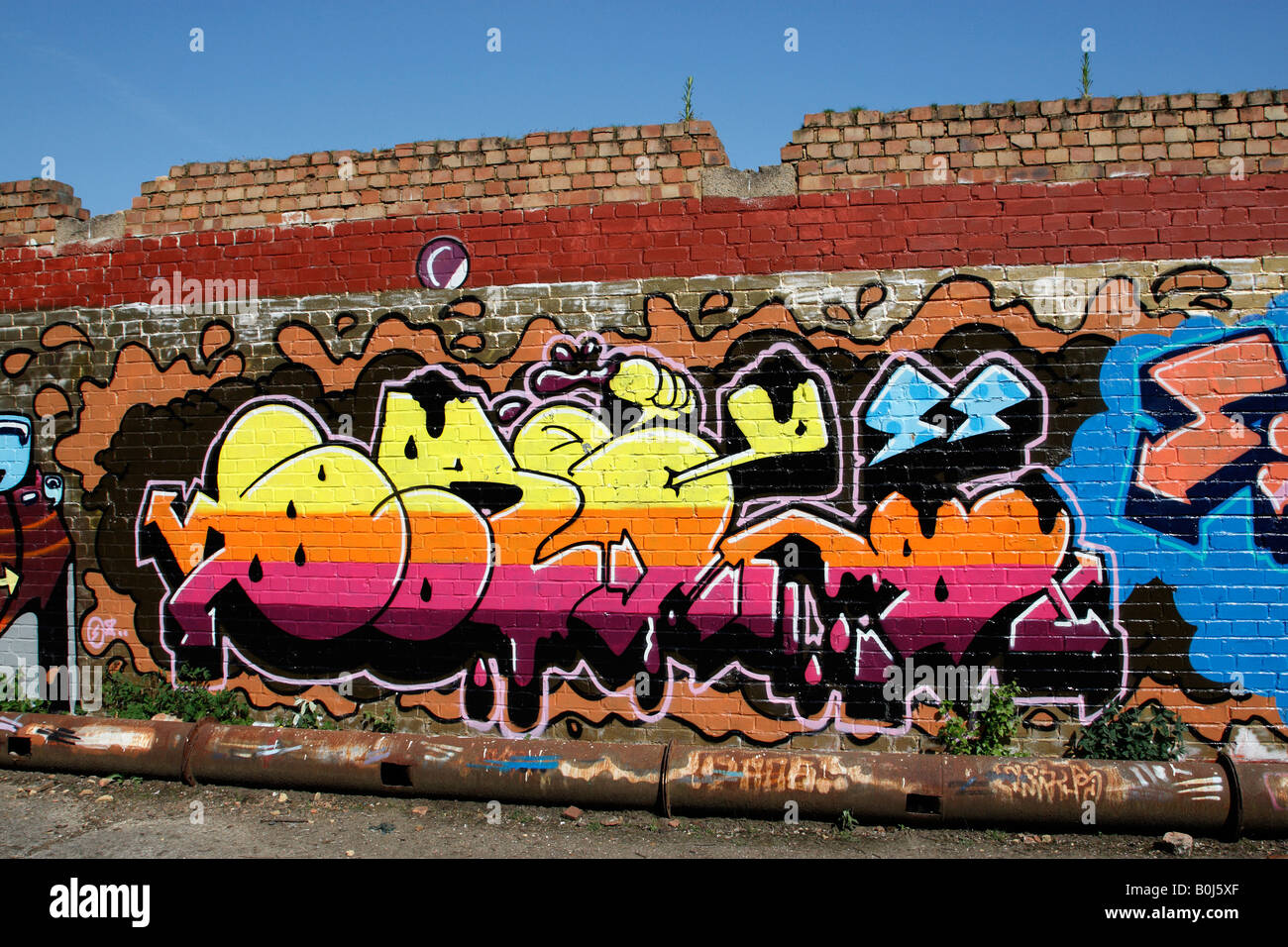 graffiti painted brick wall ewhurst surrey england uk Stock Photo - Alamy