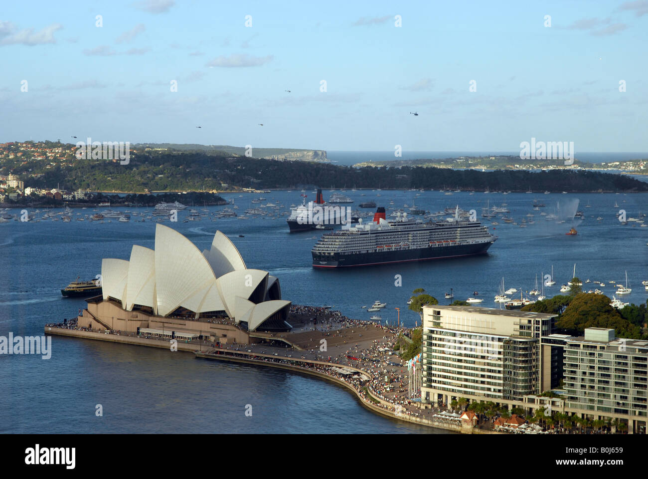 The QE2 passing the Queen Victoria and leaving Sydney for the last time ...