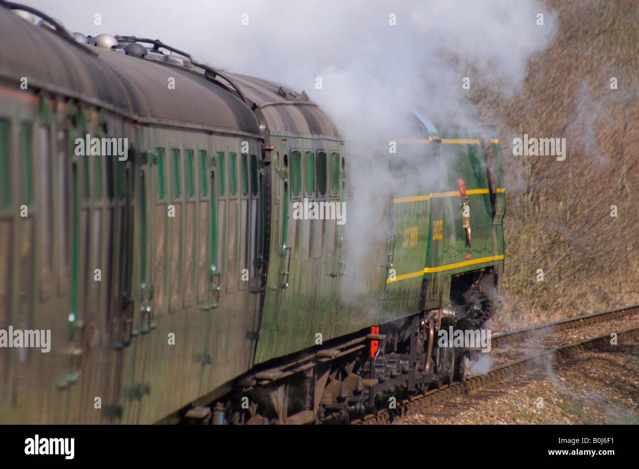 View of steam engine (locomotive) from carriage on the Bluebell Railway ...