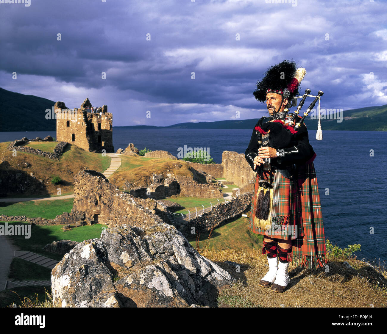 Scottish Bagpiper at Castle Urquhart Loch Ness Scotland Stock Photo - Alamy