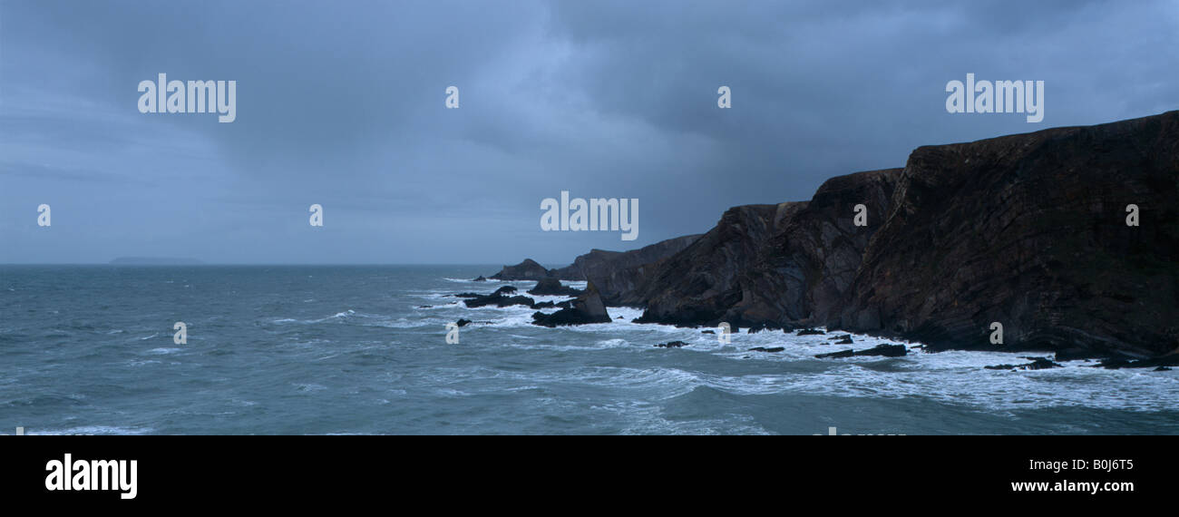 Hartland Quay, on the North Devon coast. The outline of Lundy Island ...