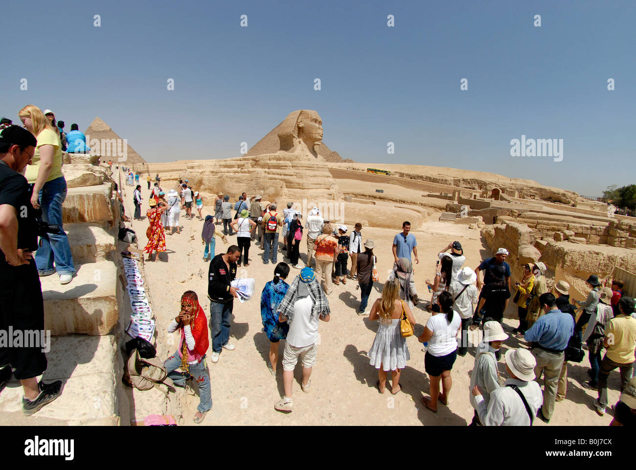 Tourists visiting the Sphinx and the Pyramids at Giza Cairo Egypt Stock ...