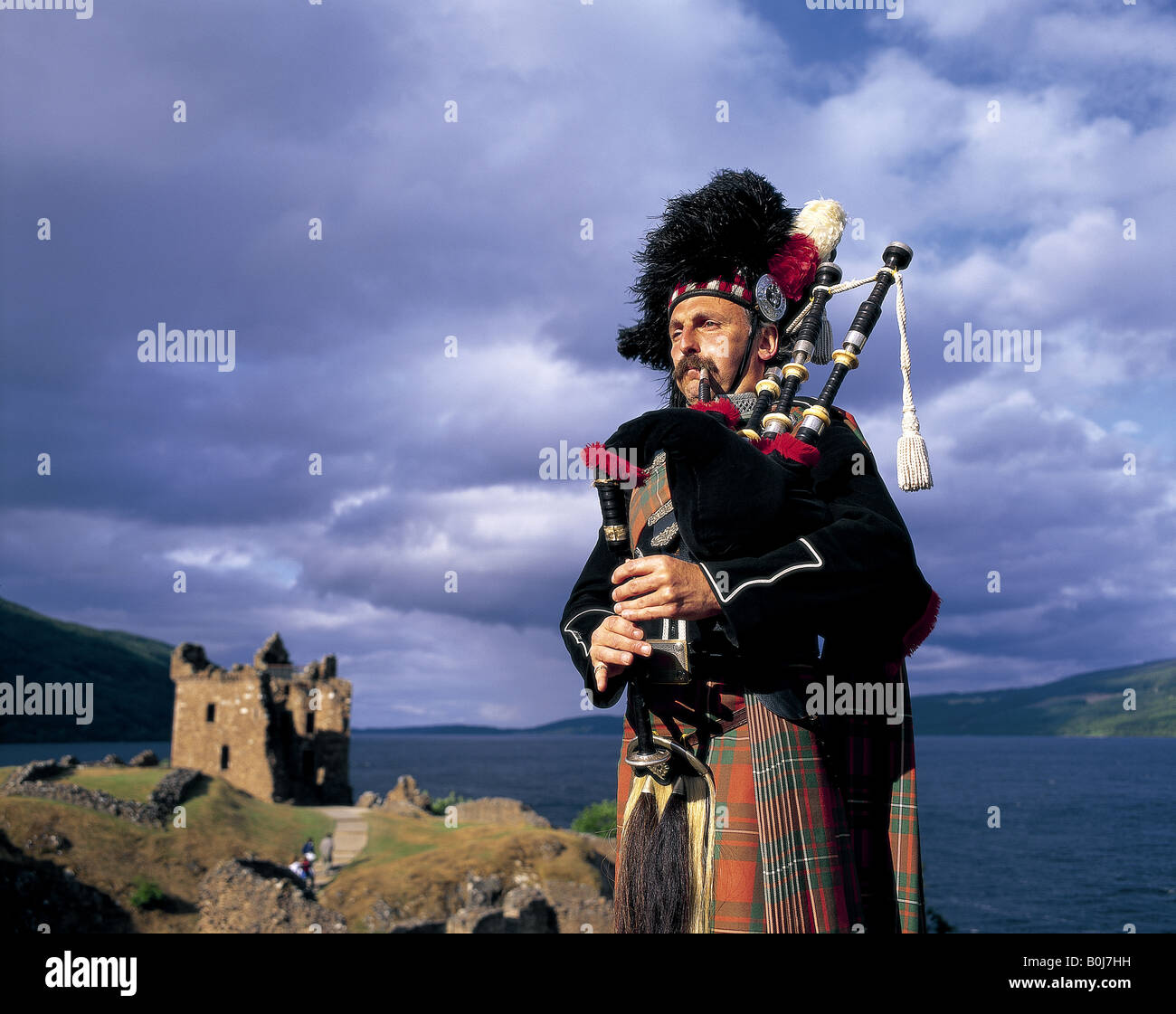 Scottish Bagpiper at Castle Urquhart Loch Ness Scotland Stock Photo - Alamy