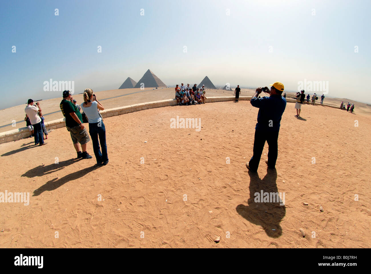 Tourists photographing the Pyramids at Giza Cairo Egypt Stock Photo - Alamy