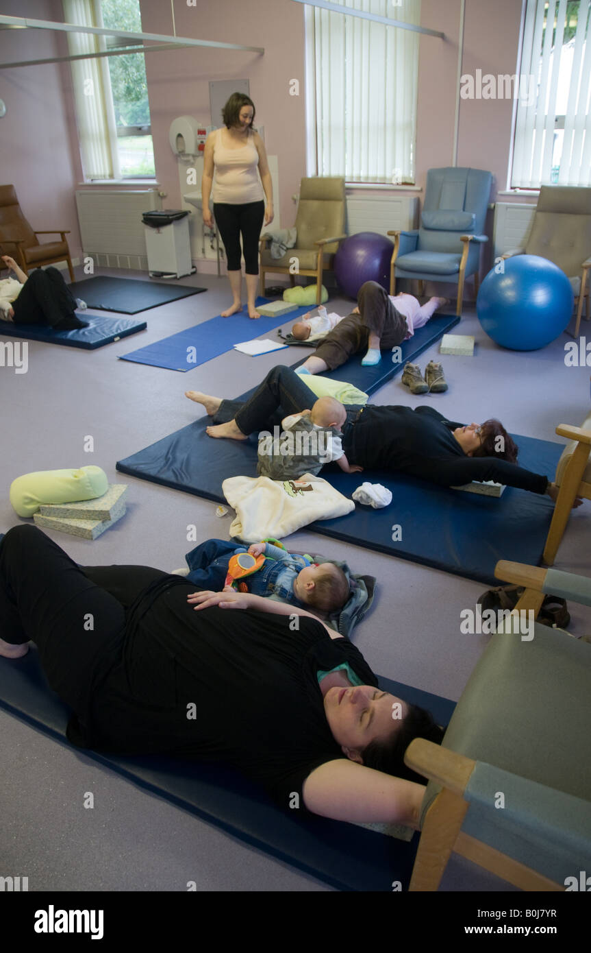Yoga class session for new mothers with their very young babies in an ...